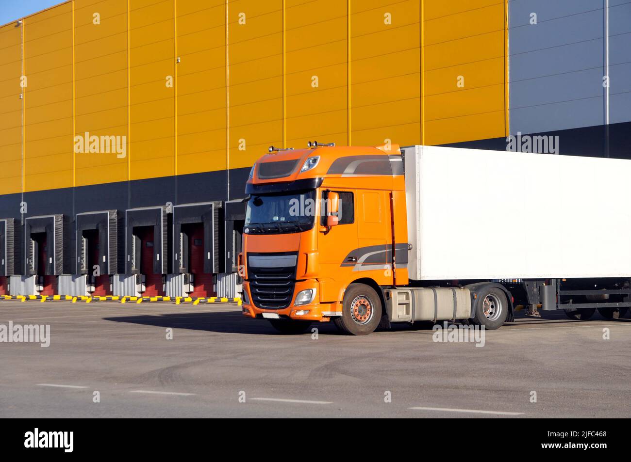 Modern logistics complex. Unloading trucks in a modern warehouse Stock ...