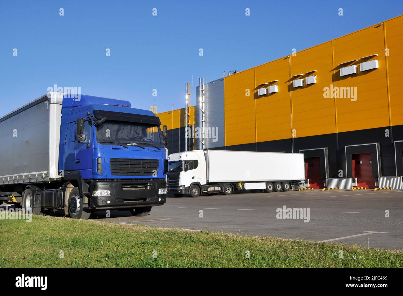 Modern logistics complex. Unloading trucks in a modern warehouse Stock ...