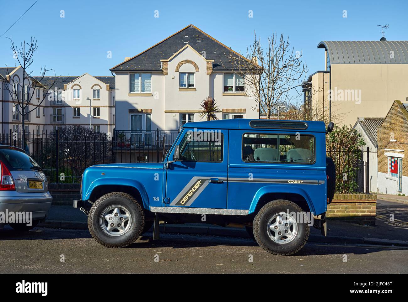 The blue Land Rover Defender parked on the street. Ramsgate, England ...