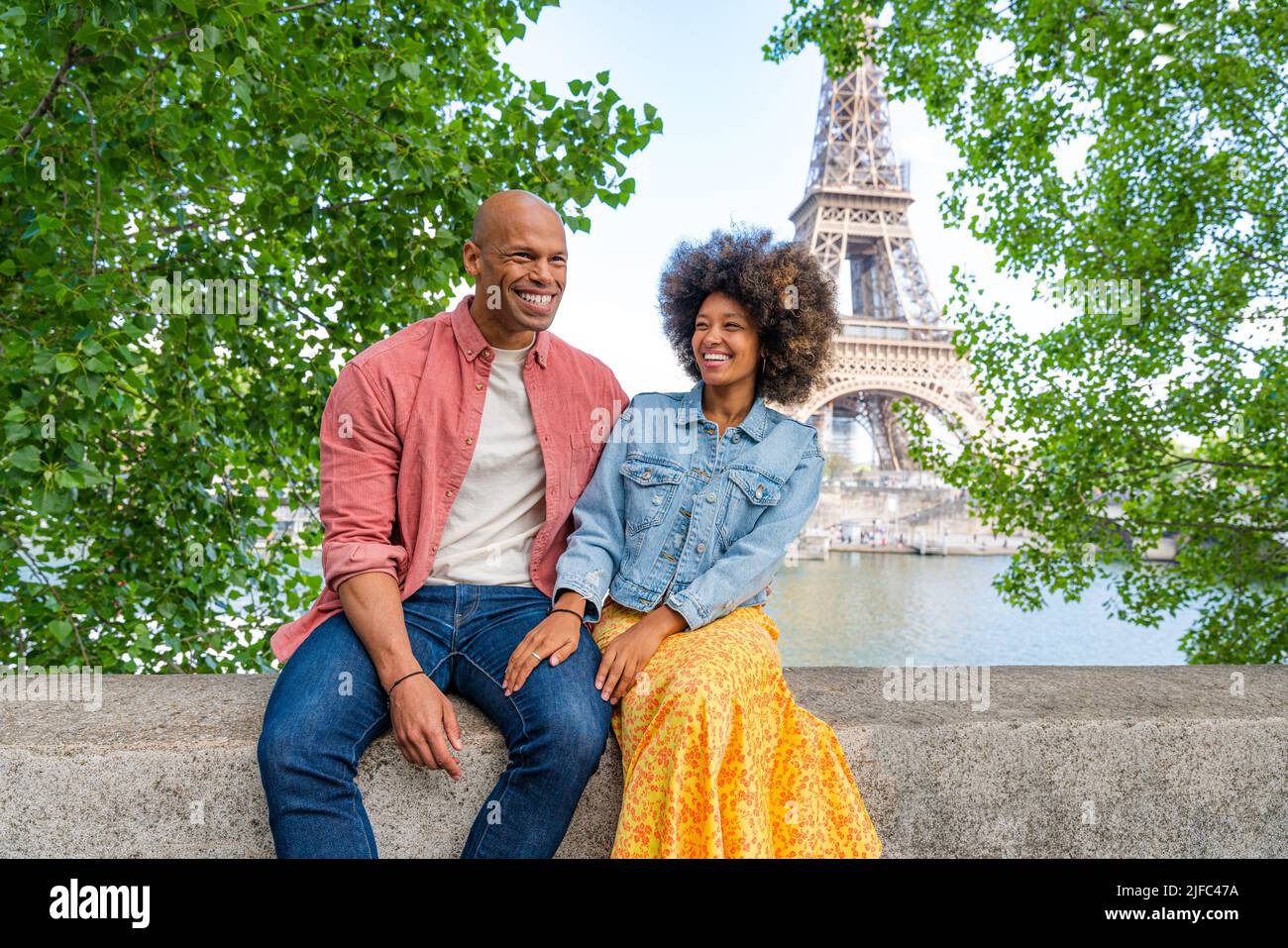 Black cheerful happy couple in love visiting Paris city centre and ...