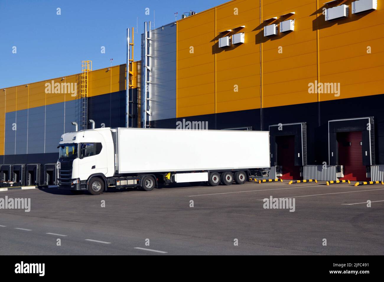 Modern logistics complex. Unloading trucks in a modern warehouse Stock ...