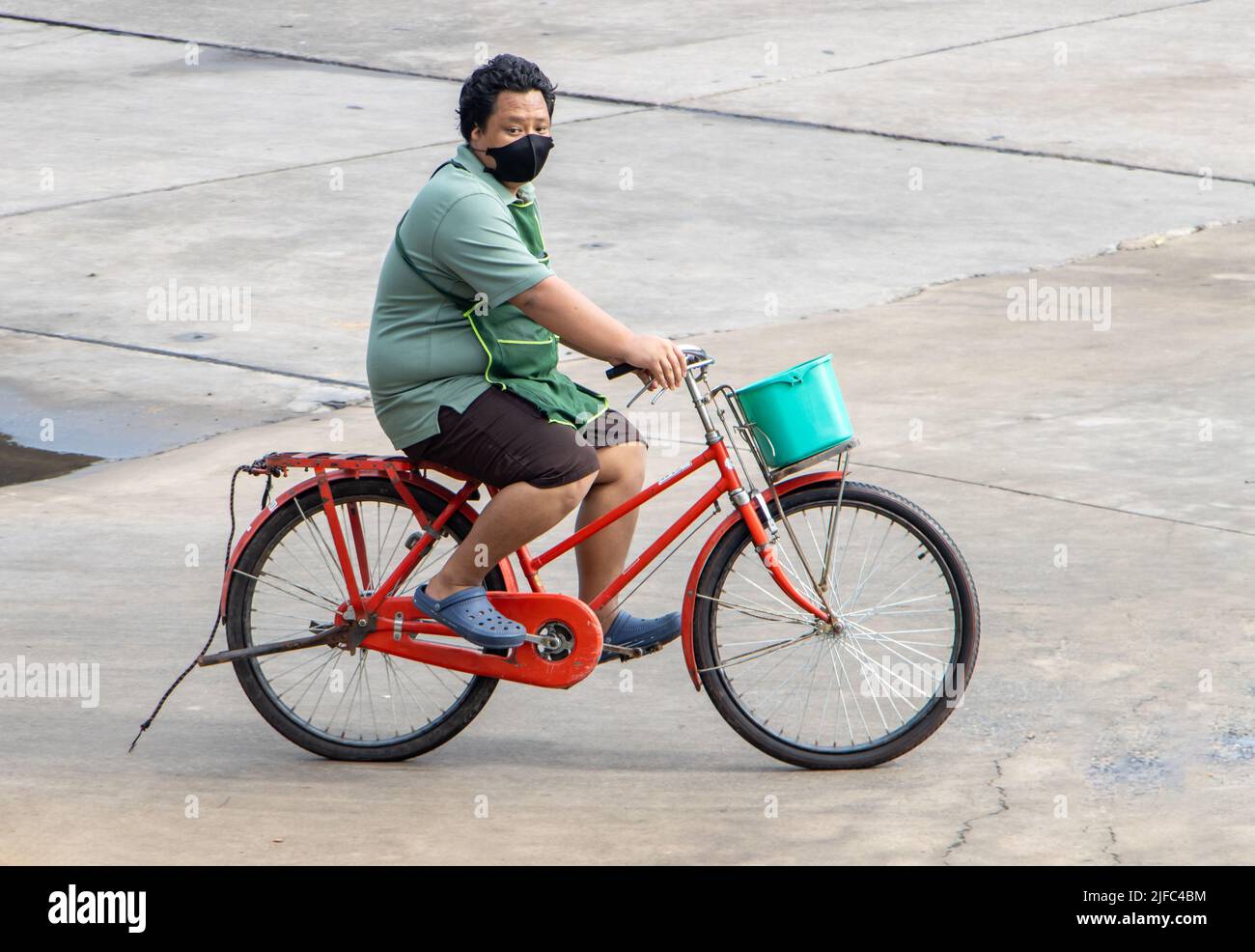 Fat man on bicycle hi-res stock photography and images - Alamy