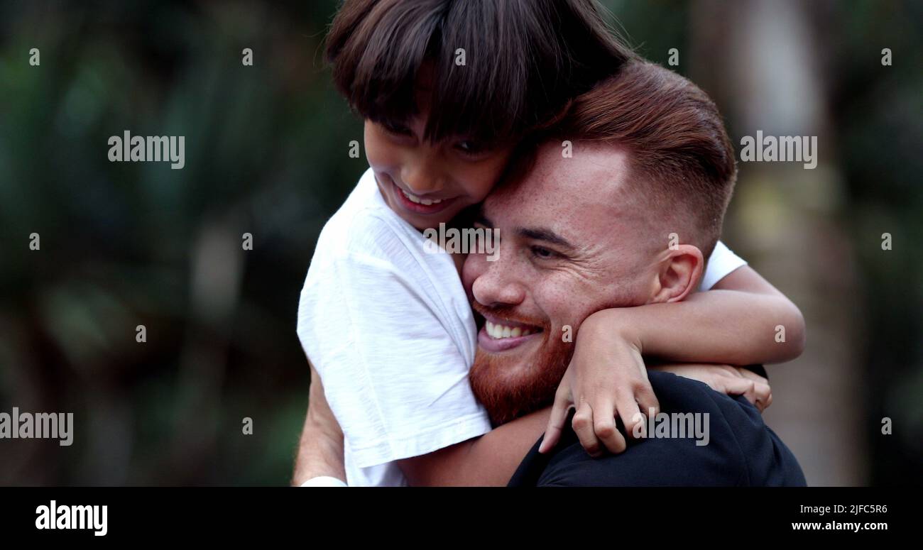 Father and son embrace, child hugging parent, diversity mixed race ...