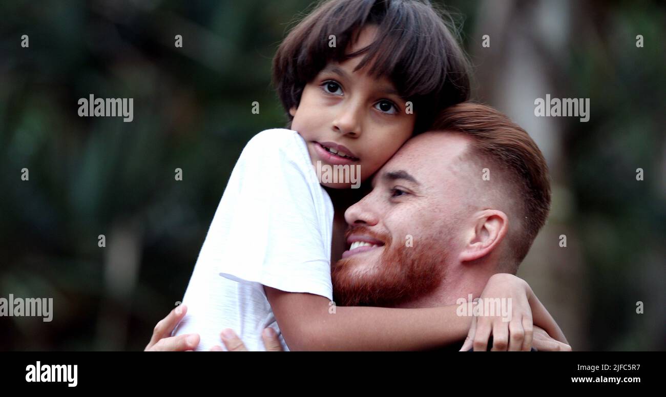Father and son embrace, child hugging parent, diversity mixed race ...