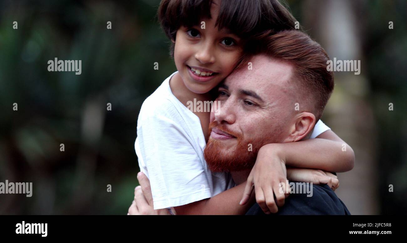 Father and son embrace, child hugging parent, diversity mixed race ...