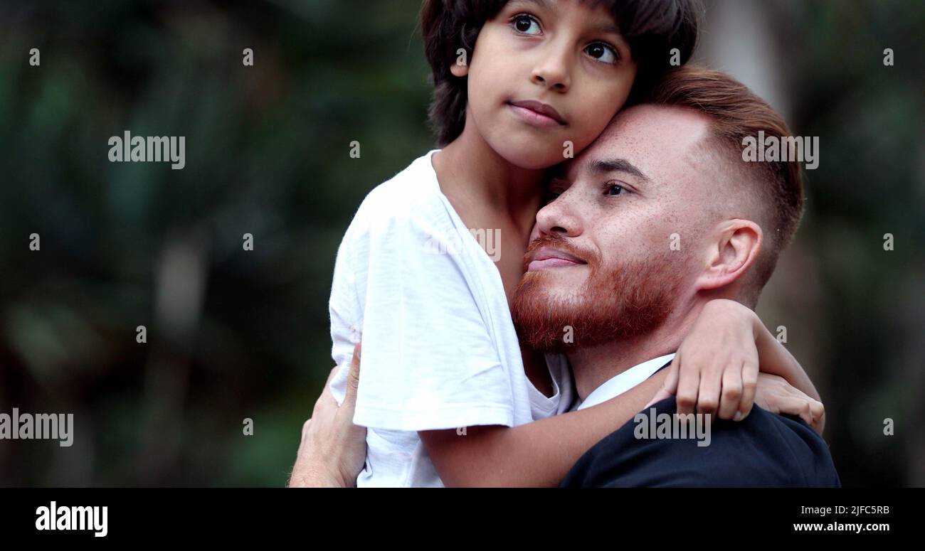 Father and son embrace, child hugging parent, diversity mixed race ...