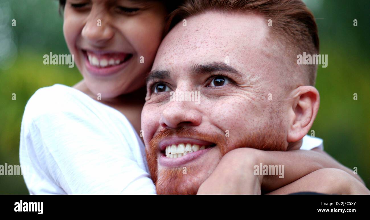 Father and son embrace, child hugging parent, diversity mixed race ...