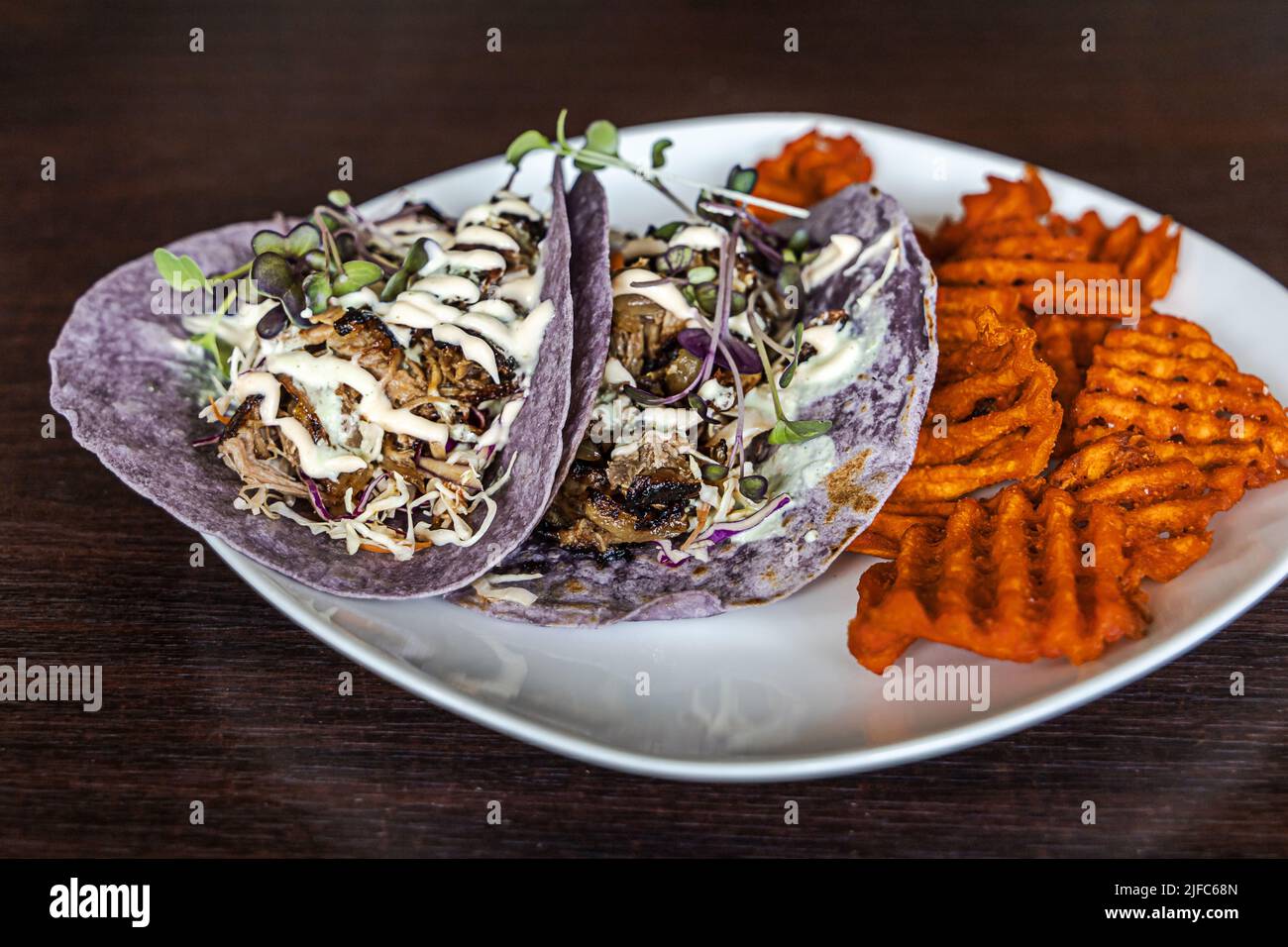 Ube tortilla fish tacos witha side of crispy waffle sweet potato fries ...