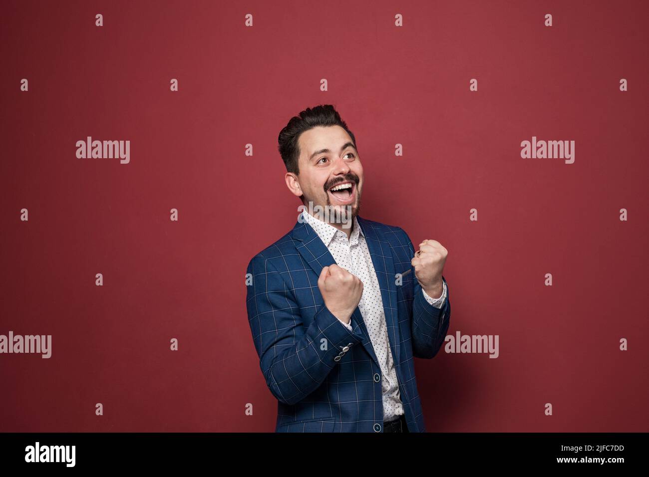 Celebration and victory concept. Cheerful triumphing lucky businessman ...