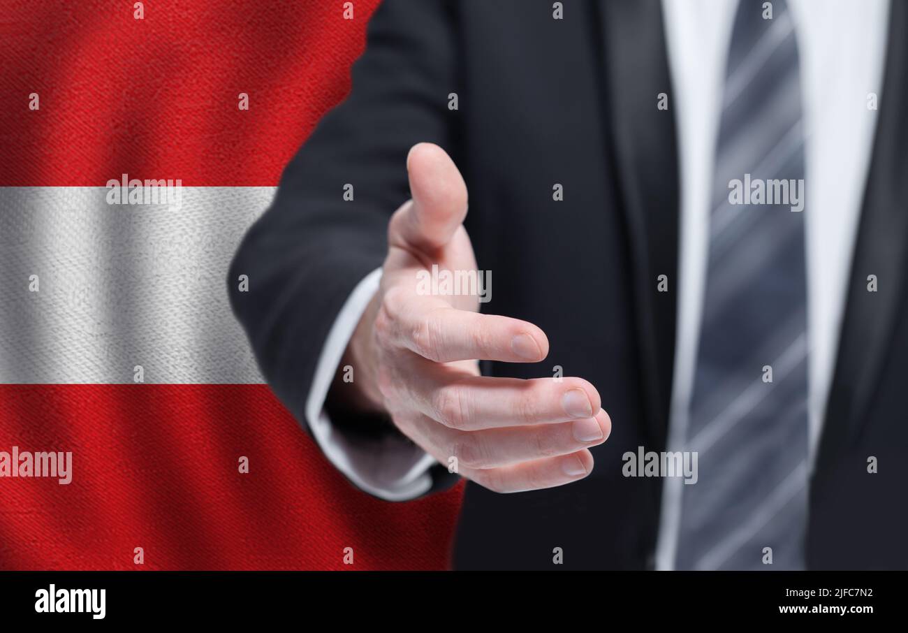 Welcome to the Austria. Hand on Austrian flag background. Business ...