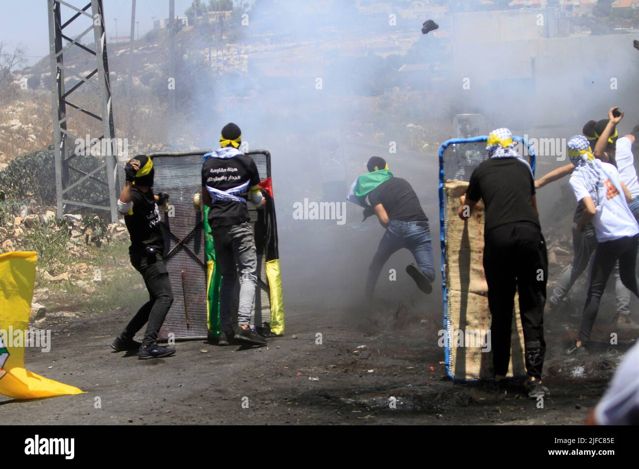 Nablus, Palestine. 01st July, 2022. Palestinian protesters hurl stones ...