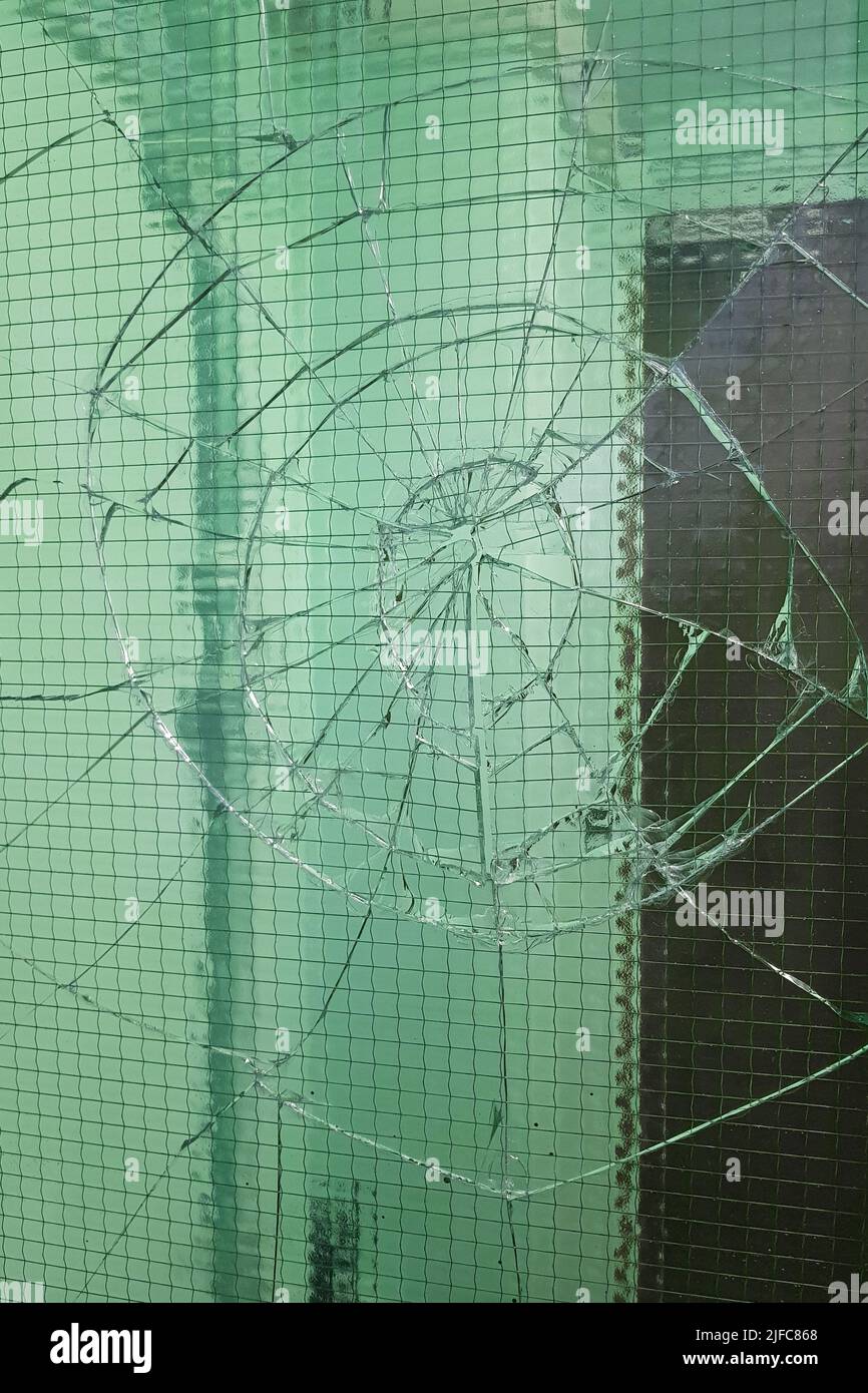 Broken glass with spider web cracks Stock Photo - Alamy
