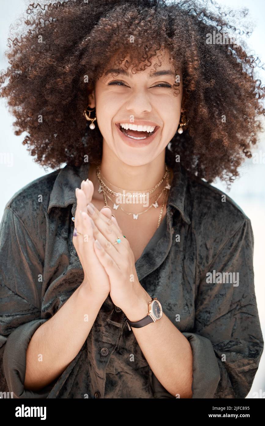 Portrait of a young beautiful mixed race woman with natural curly afro ...