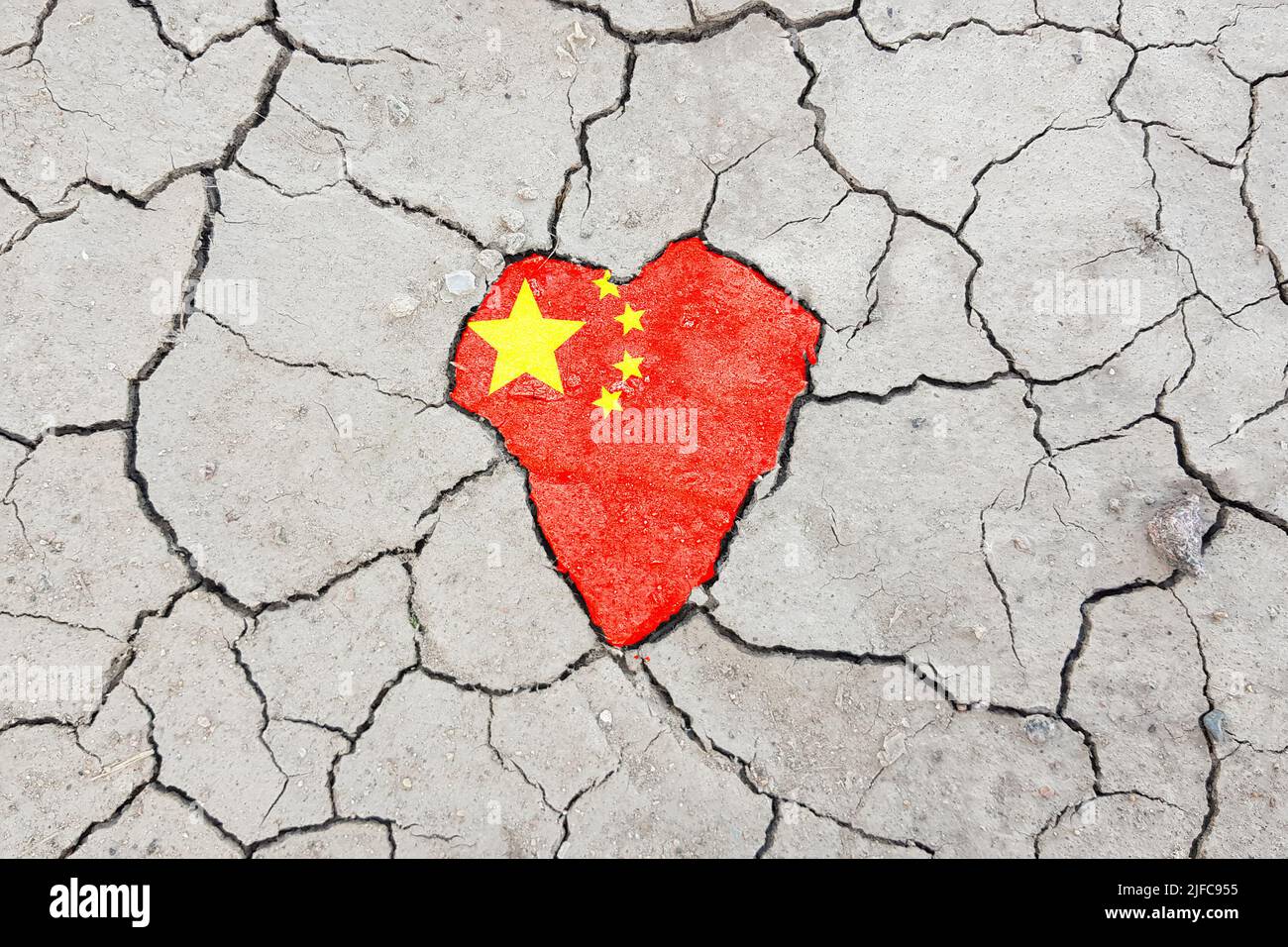 Textured background of cracked dry brown earth with Heart in Chinese ...