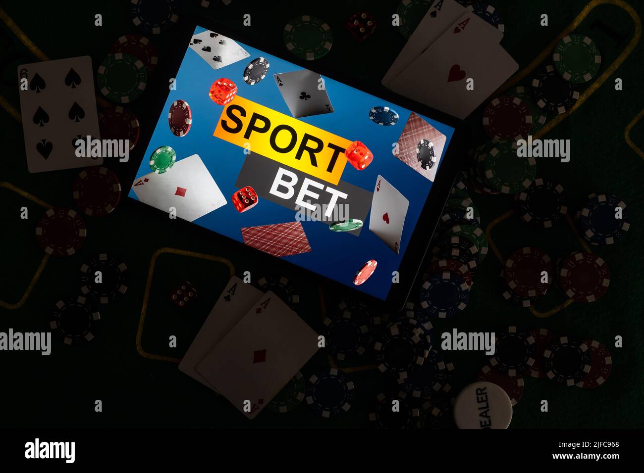 Smartphone with poket table on screen, playing cards and chip cards on ...