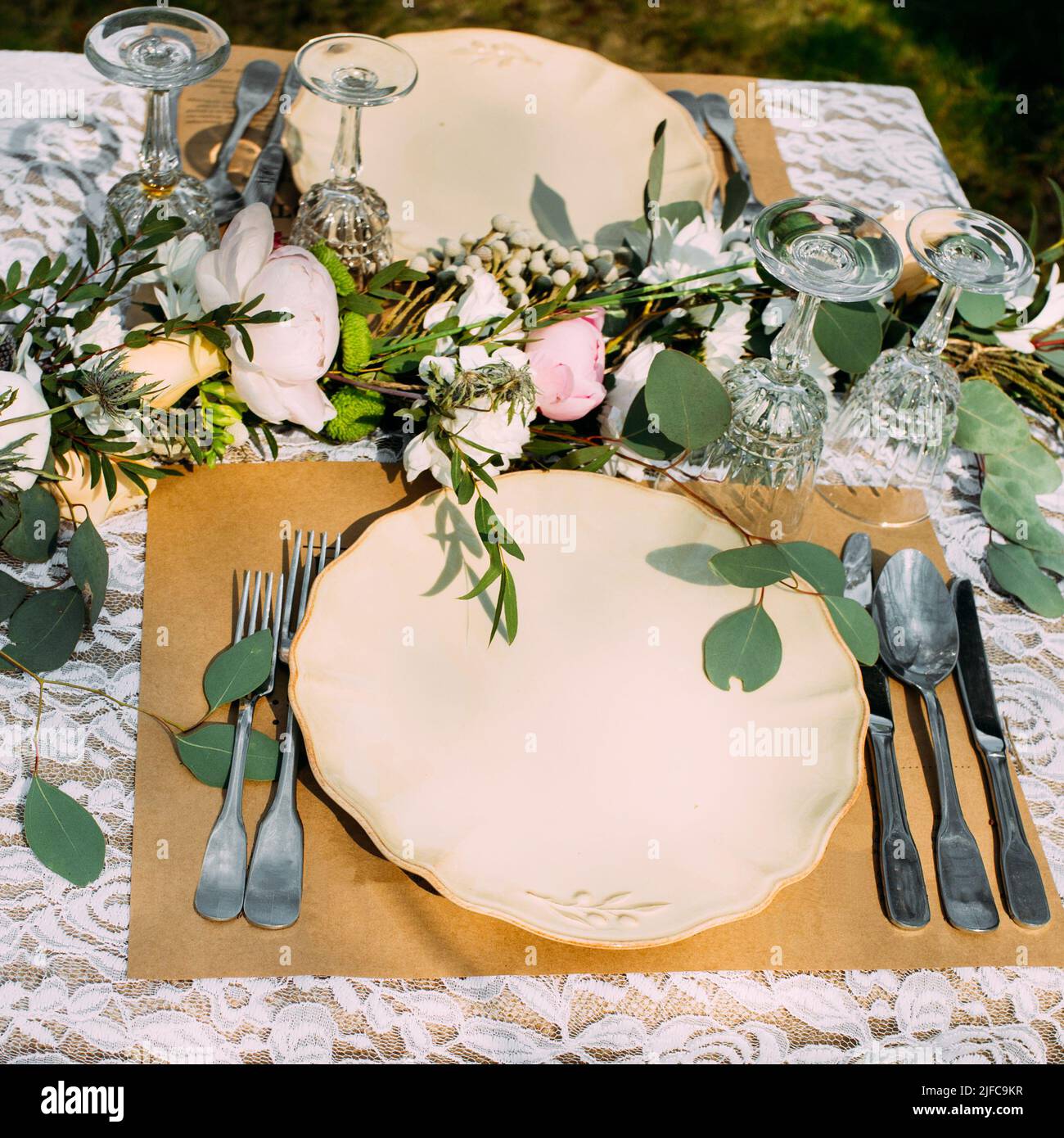 Table setting for banquet with flowers, void Stock Photo - Alamy