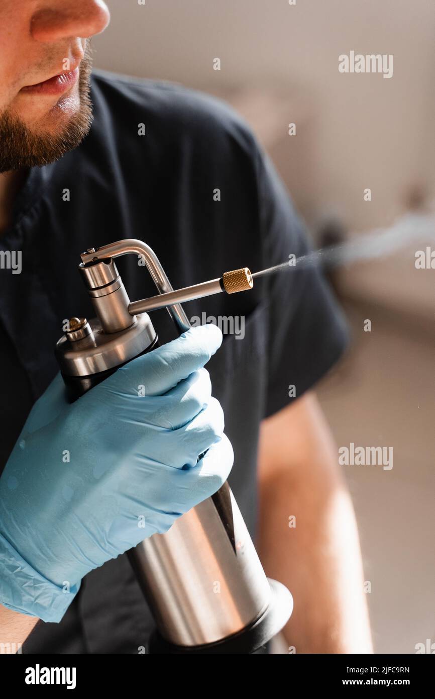 ENT doctor spray nitrogen for cryo therapy. Procedures of for mucosal ...