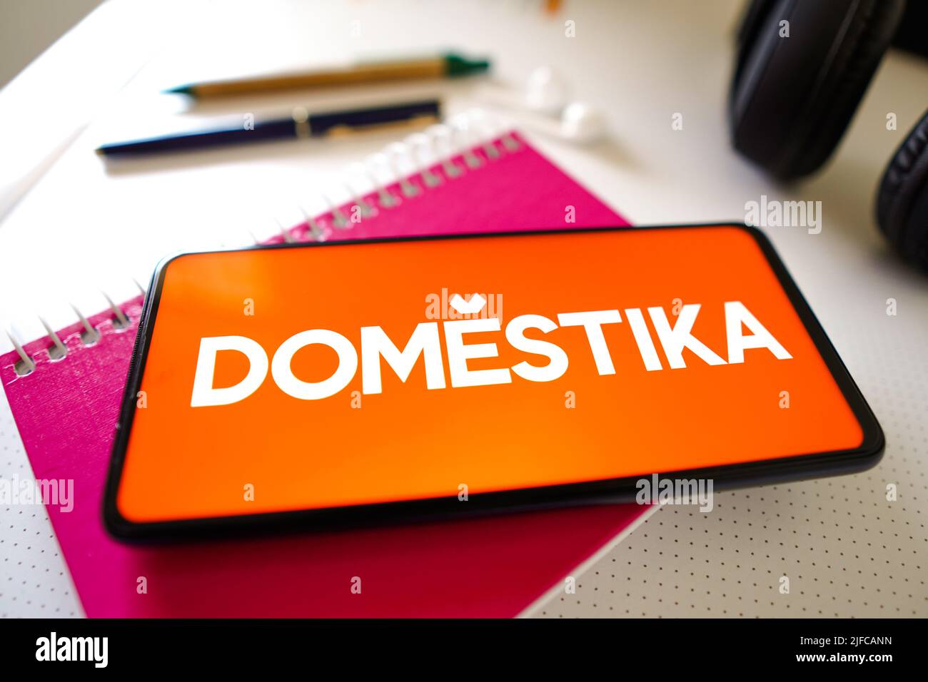 In this photo illustration the Domestika logo seen displayed on a smartphone screen Stock Photo ...