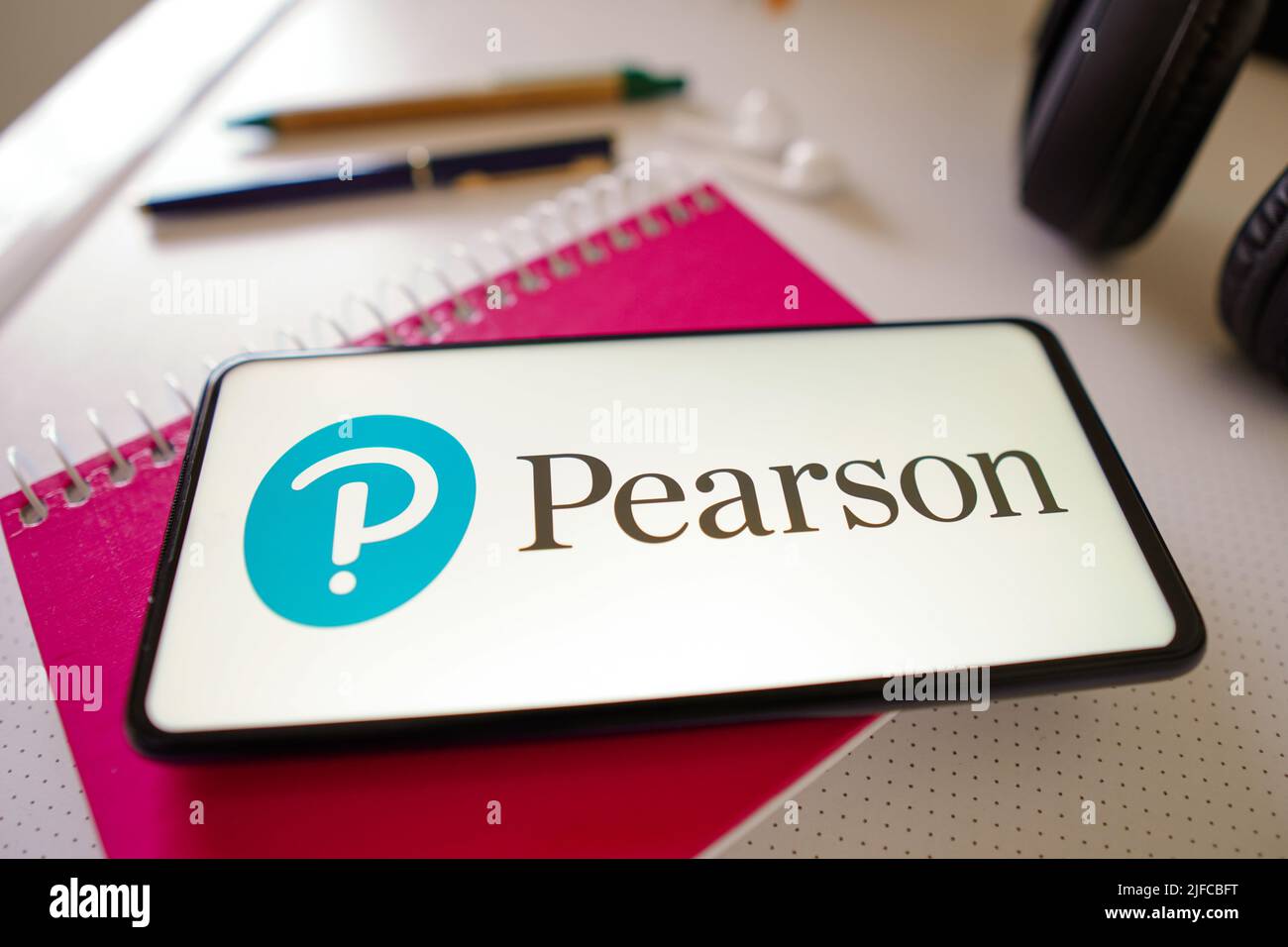In this photo illustration the Pearson Education logo seen displayed on ...