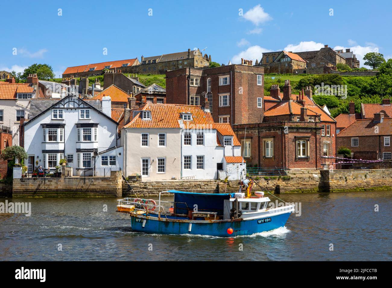Whitby, UK - June 10th 2022: A fishing boat sailing on the River Esk in ...