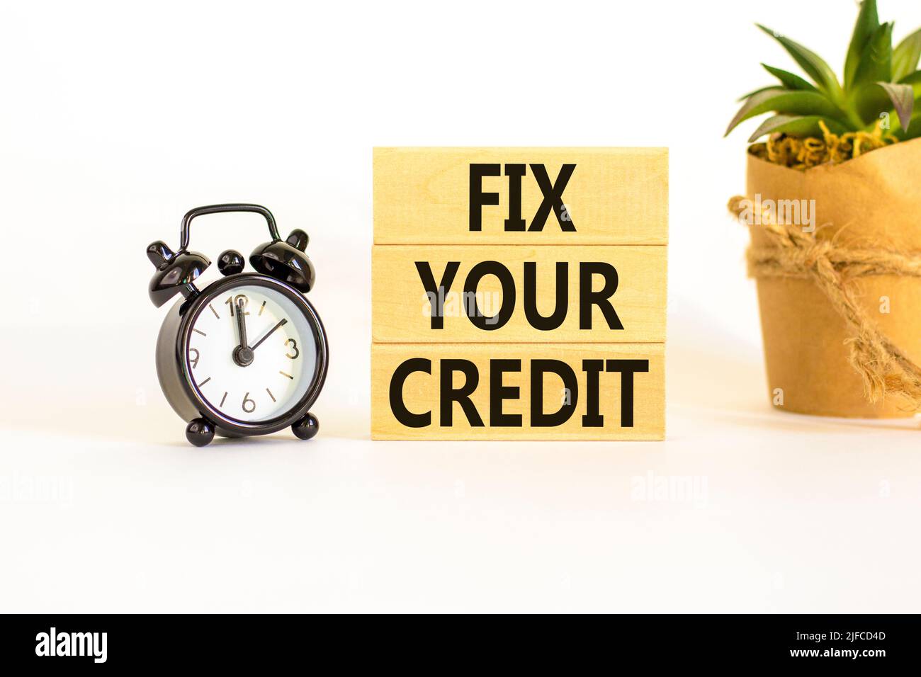 Fix your credit symbol. Concept words Fix your credit on wooden blocks ...