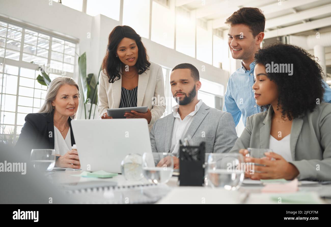 Happy Diverse Group Of Businesspeople Having A Meeting While Standing