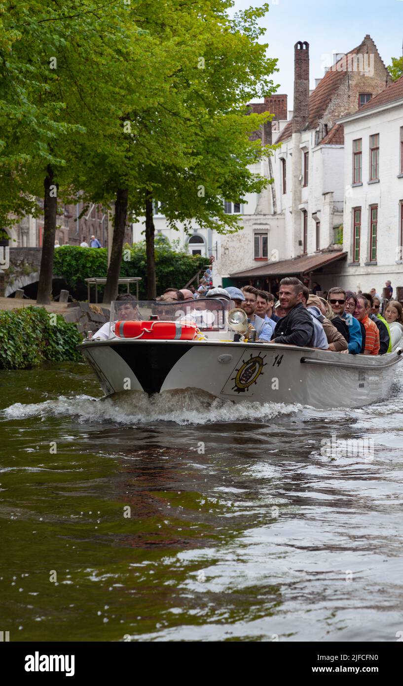 Boat tour on Bruges Waterways Stock Photo - Alamy