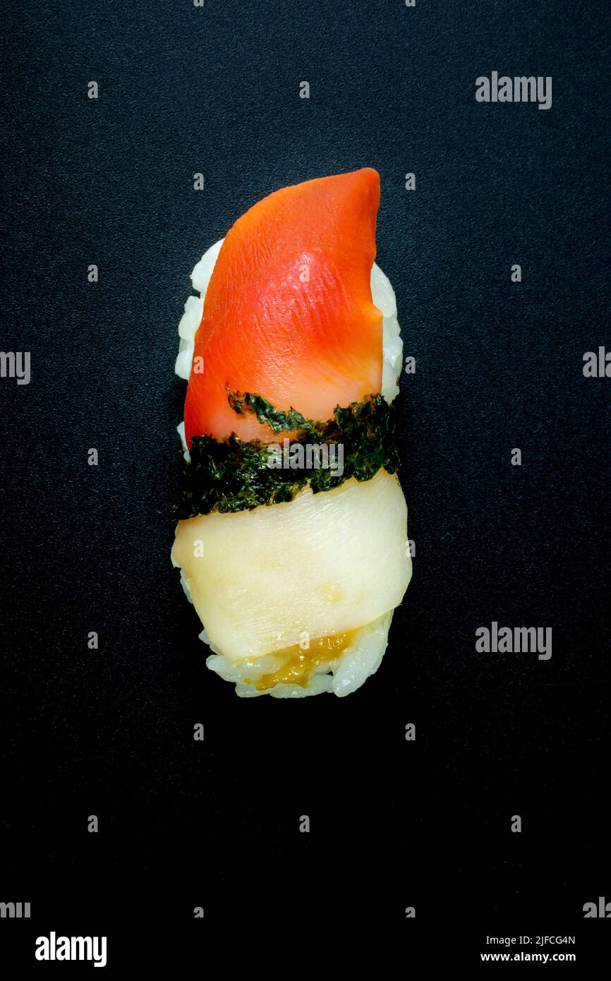 Scallop nigiri sushi on black background Stock Photo - Alamy
