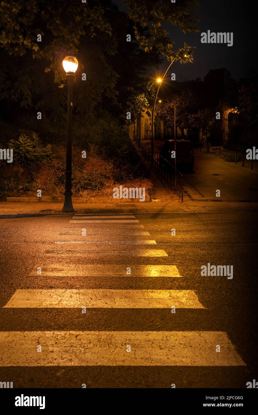 Dark street at night with a pedestrian crossing Stock Photo - Alamy