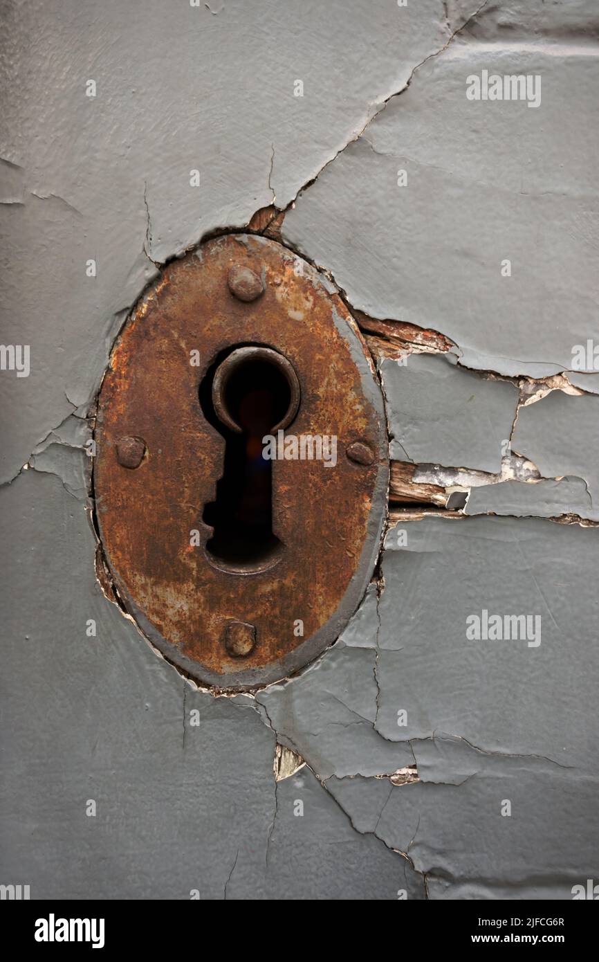 Door lock hole with rusty metal Stock Photo - Alamy