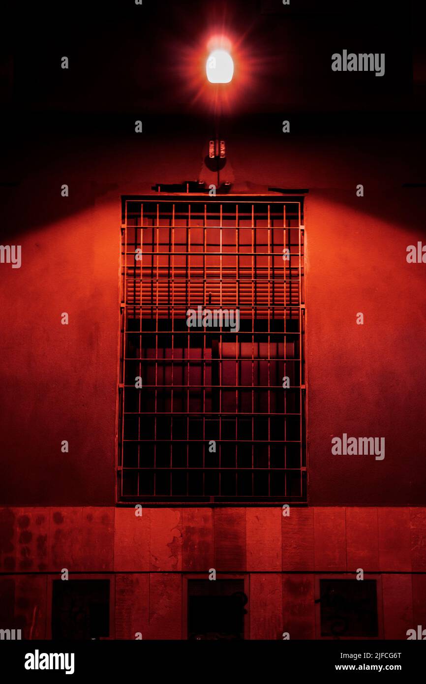Red horror window lattice with a lamp Stock Photo - Alamy