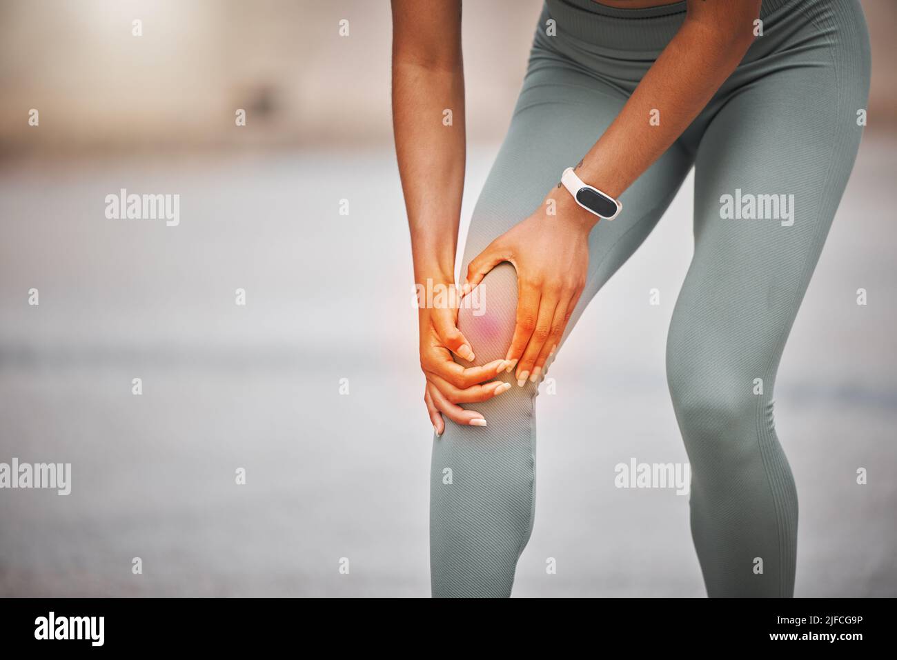 Closeup of an unrecognizable athlete suffering an injury to the knee ...