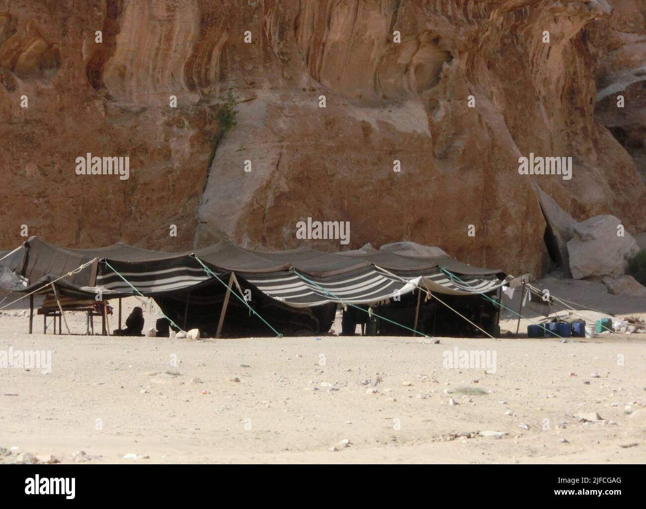 tents of a small camp of a nomadic tribe near the Rocks in the desert ...