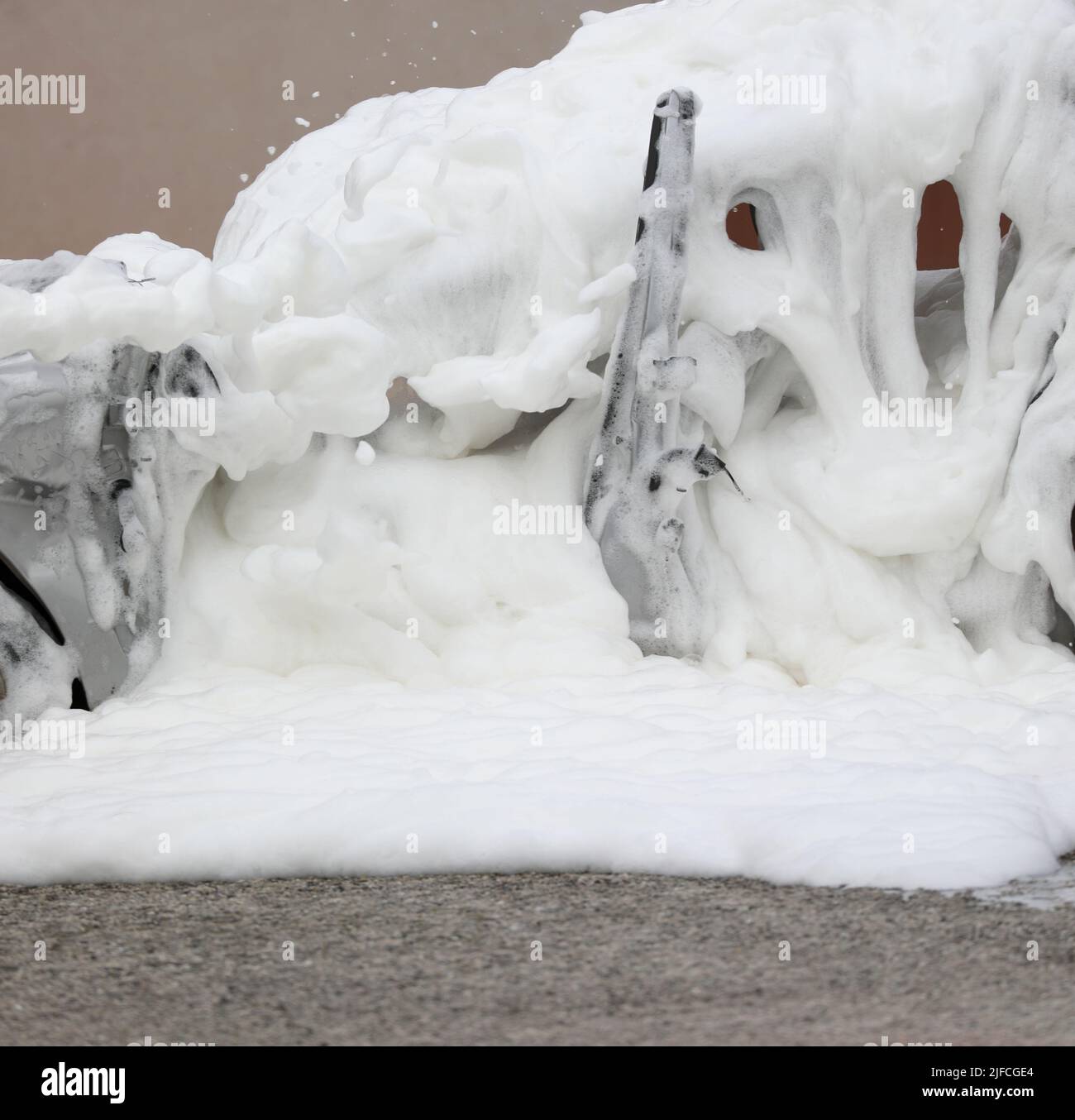 covered car with white foam after the collision on the road Stock Photo ...