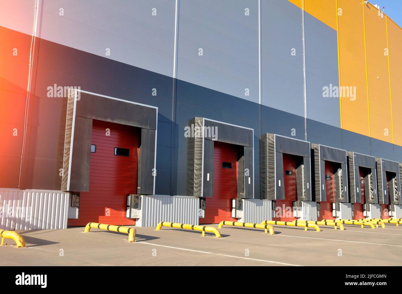 Modern warehouse complex. Warehouse building with many loading gates ...