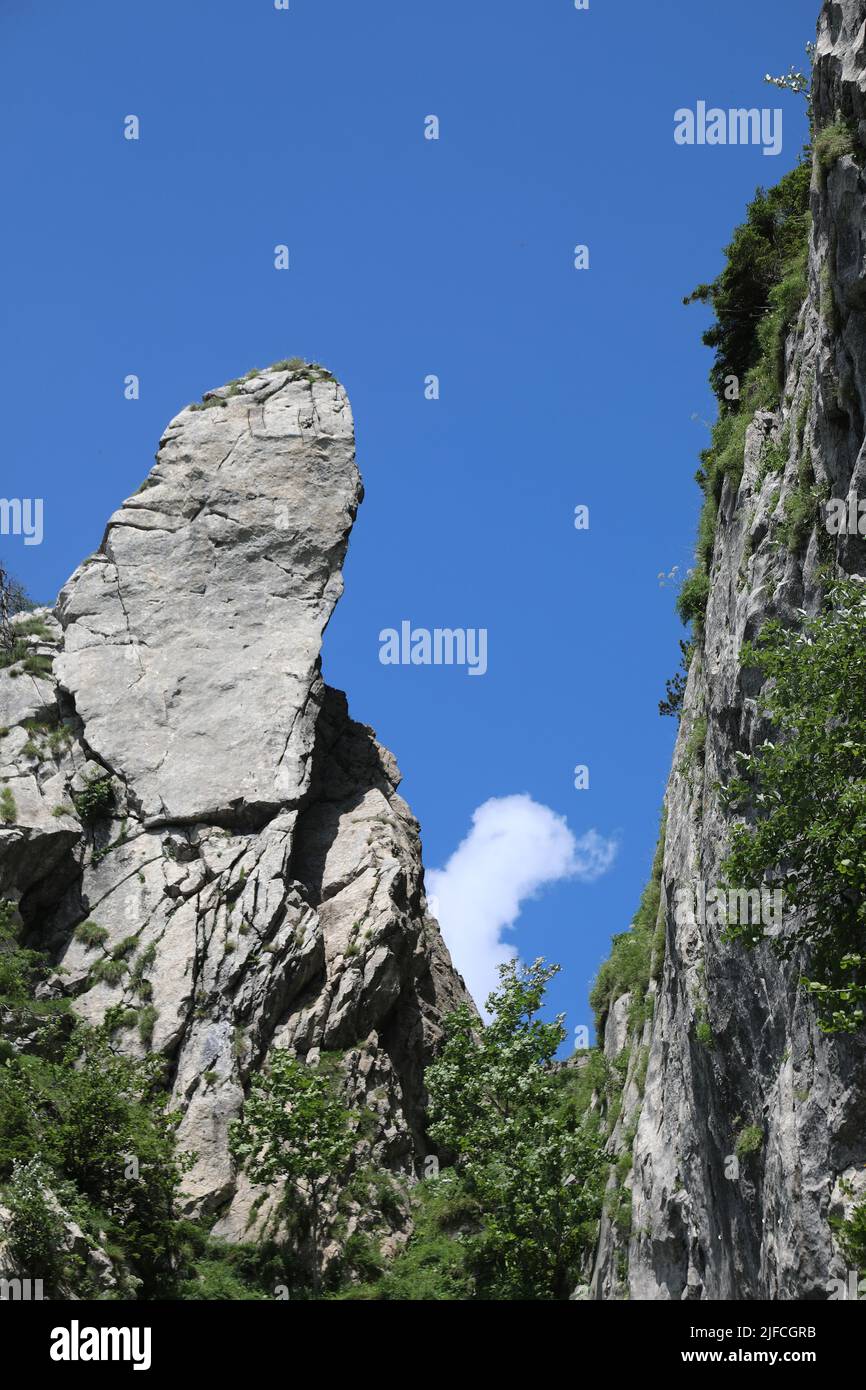 large spike of rock that looks like a nose in the Italian Alps on the ...