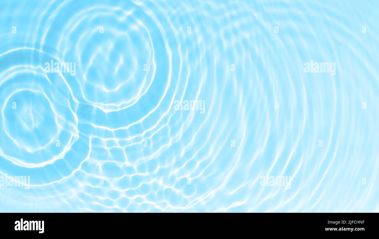 The surface of light on the light blue transparent swimming pool water ...