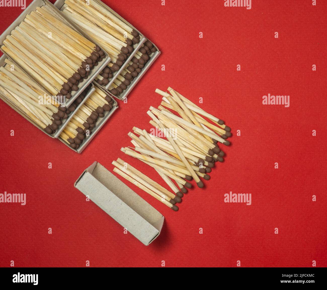 Matchsticks on a red background. Safe handling of fire. Fire dangers ...