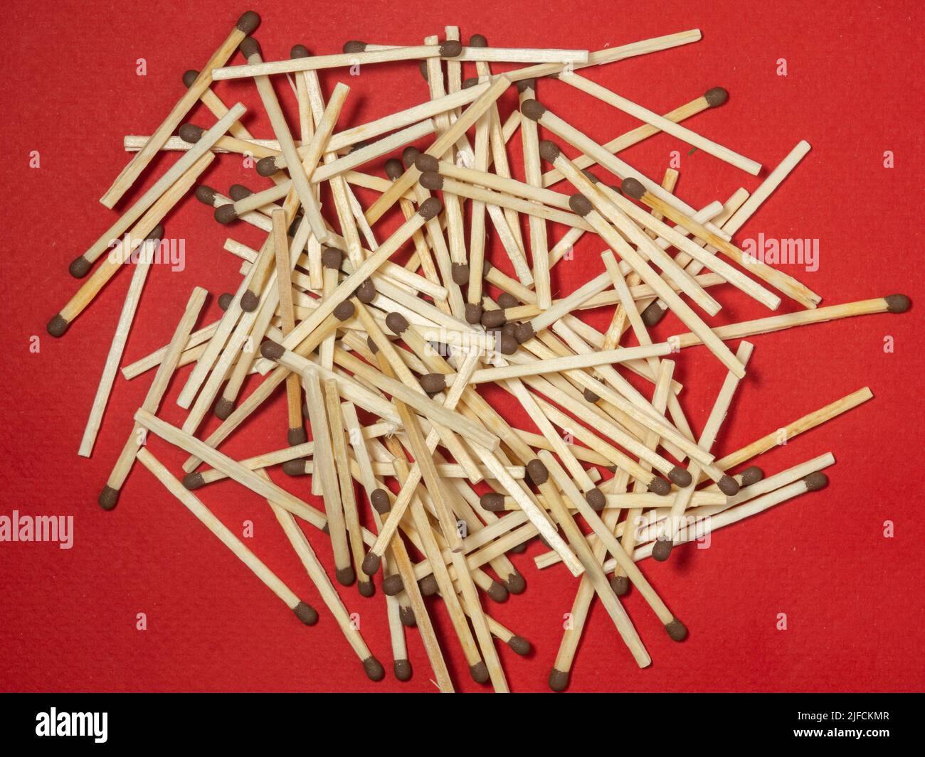 Matchsticks on a red background. Safe handling of fire. Fire dangers ...