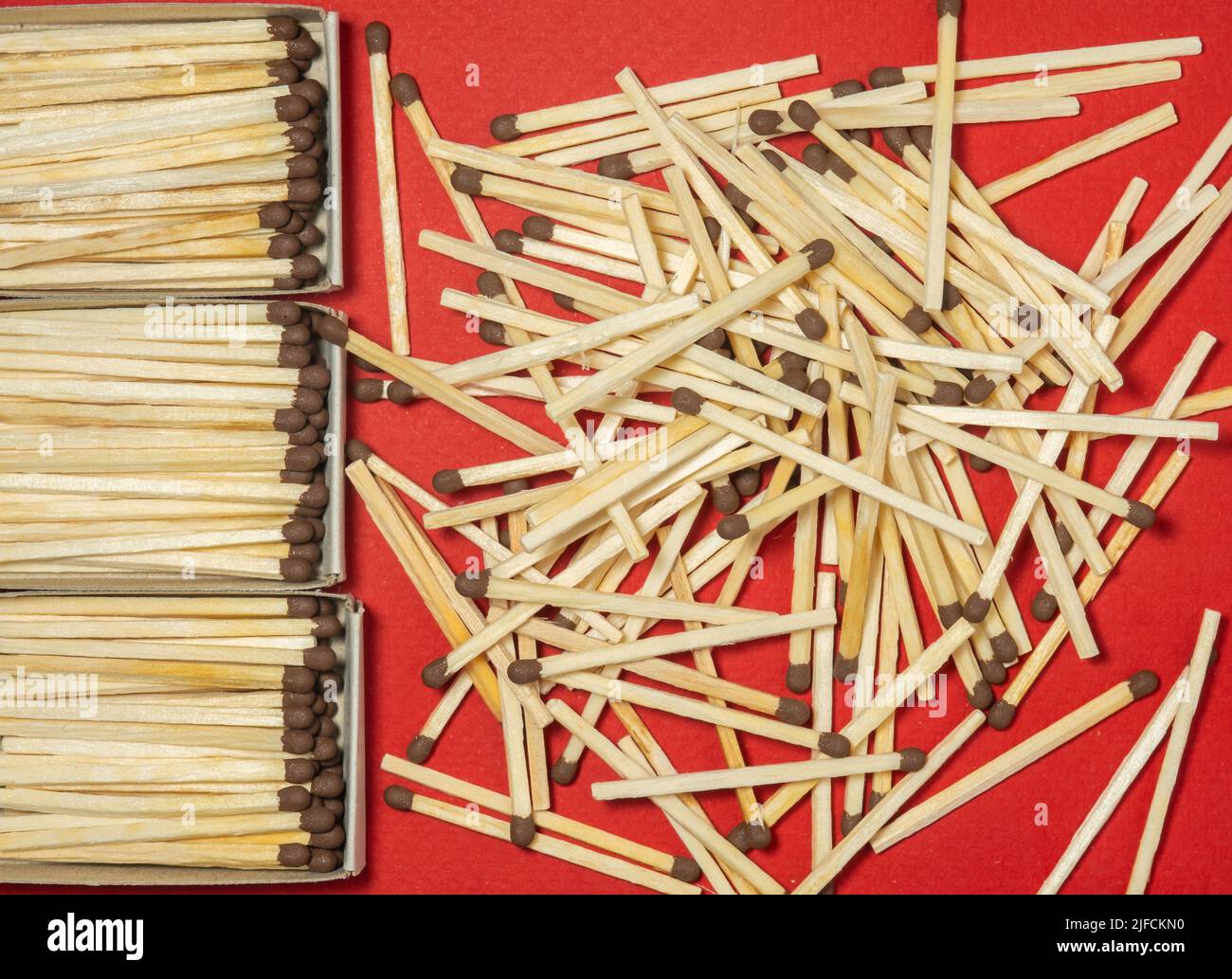 Matchsticks on a red background. Safe handling of fire. Fire dangers ...