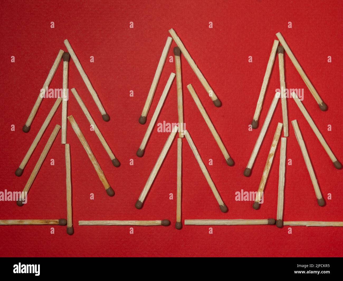 Matches on a red background. Safe handling of fire. Fire dangers. Lots ...