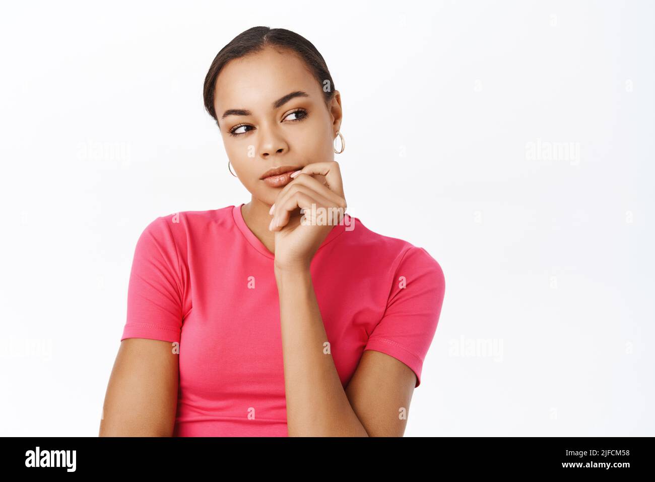Image of thoughtful girl, looking aside and planning smth in her head ...