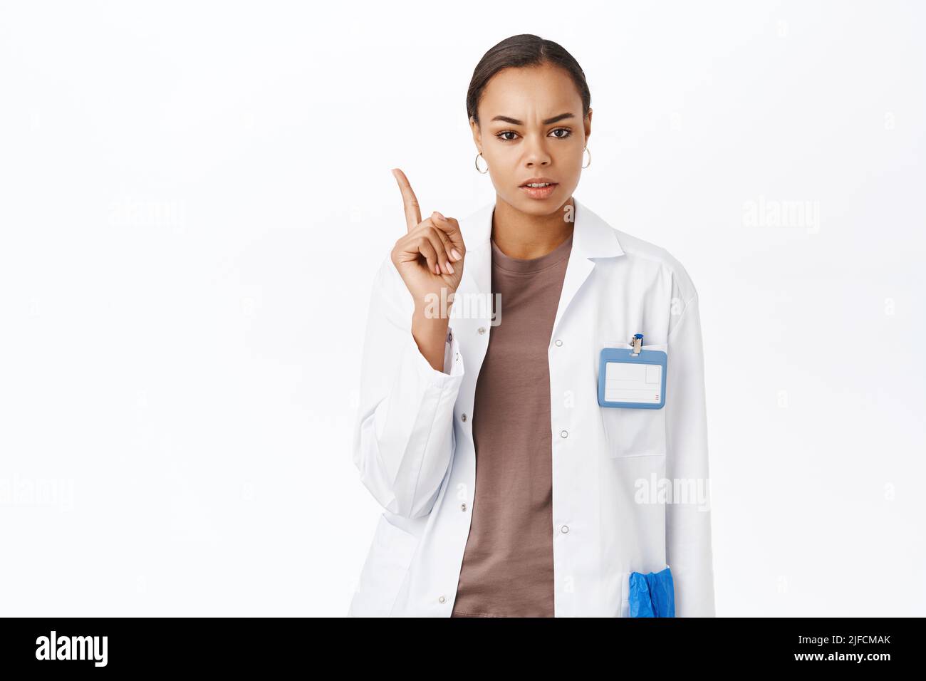 Doctor shaking finger in disapproval, prohibit something to patient ...