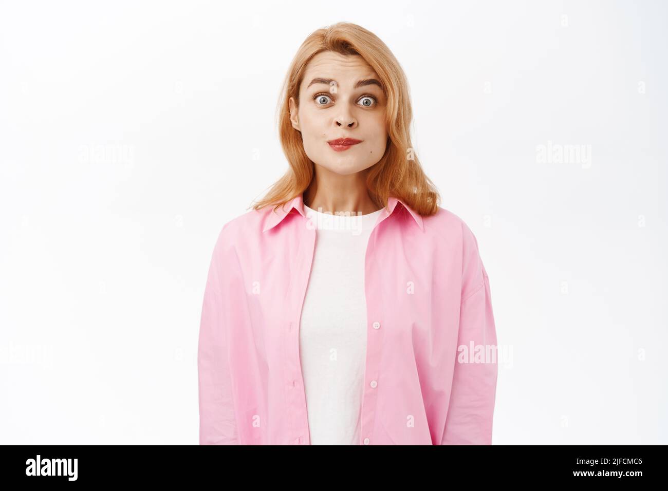 Image of girl looks with excitement, wants something, expecting or ...