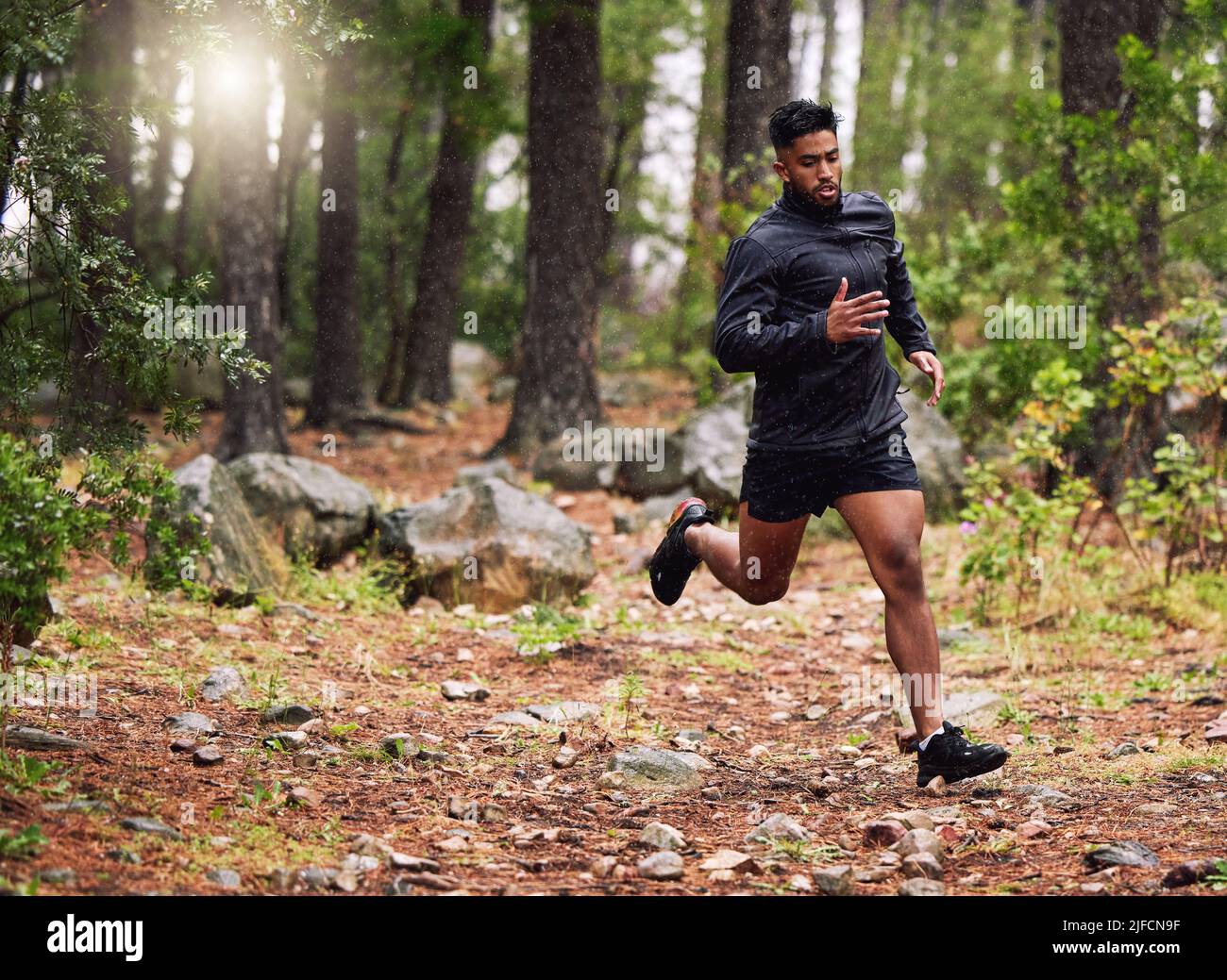 Athletic man running in a park. Muscular male training outside. Jogger ...
