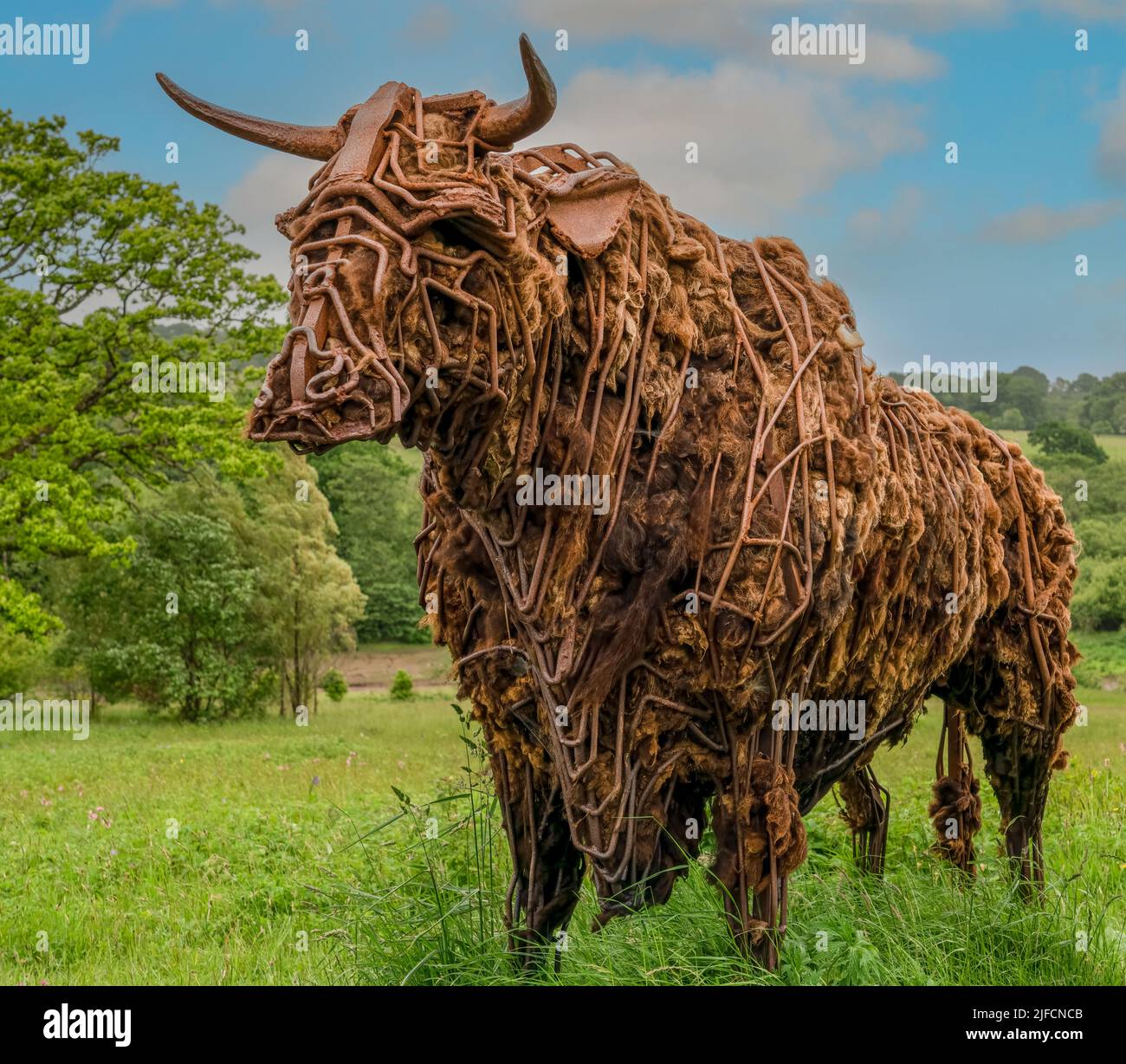 close up of a model bull made from a metal iron cage frame filled with ...