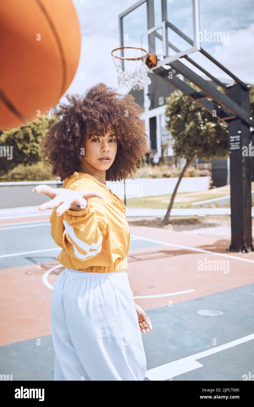 Mixed race woman posing on a basketball court. Beautiful basketball ...