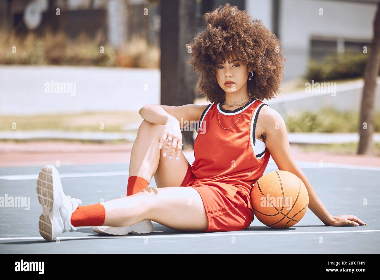 Mixed race woman posing on a basketball court. Beautiful basketball ...