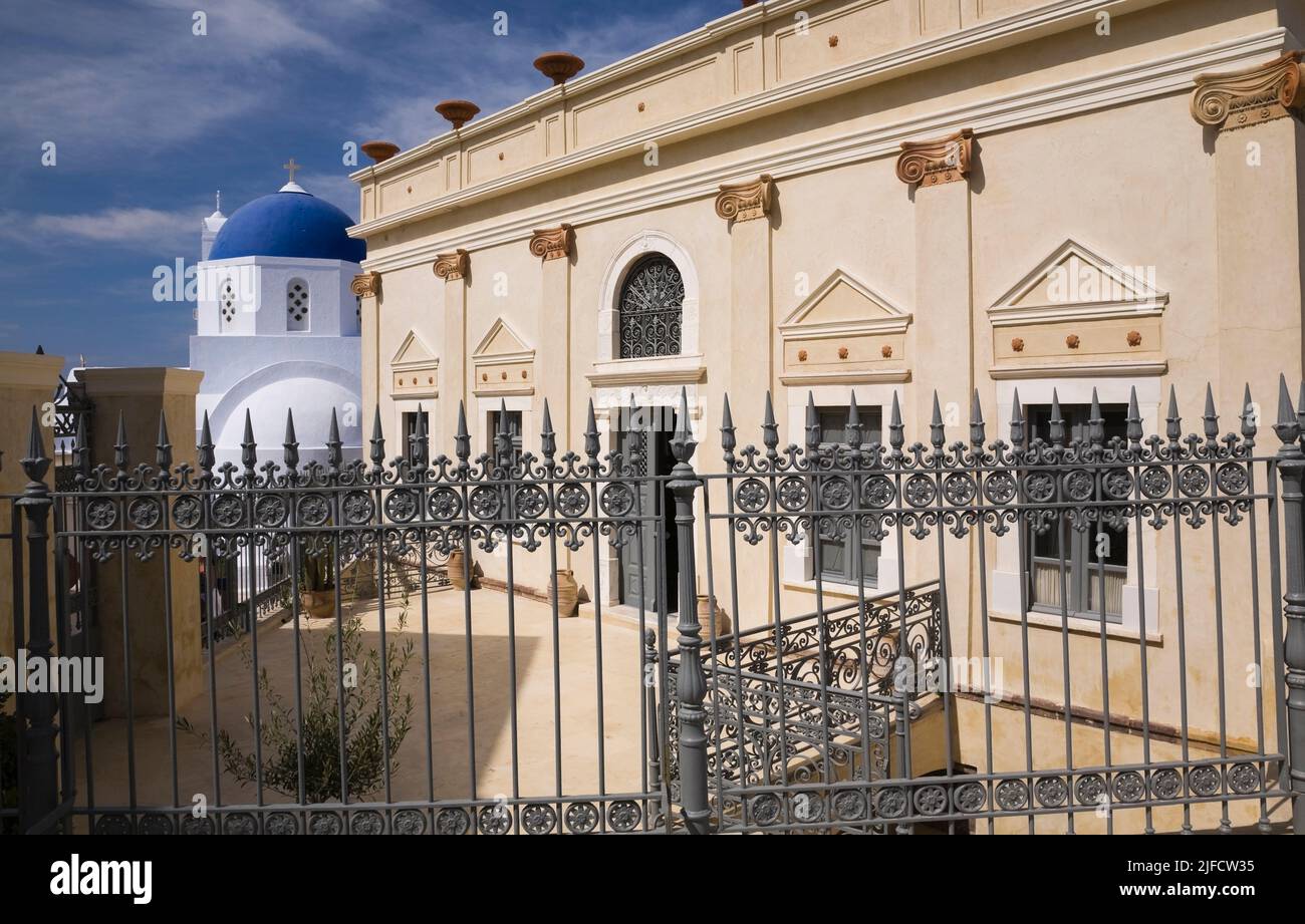 Restored old architectural hotel building and blue domed chapel, Pyrgos ...