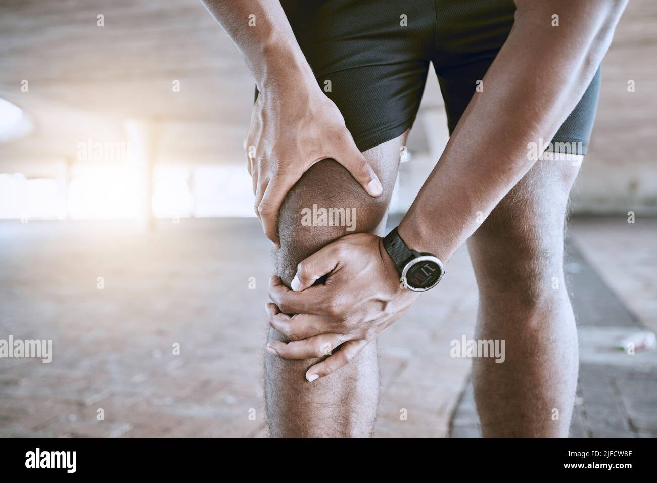 Sportsman suffering from an injury while out for a workout. Sports ...